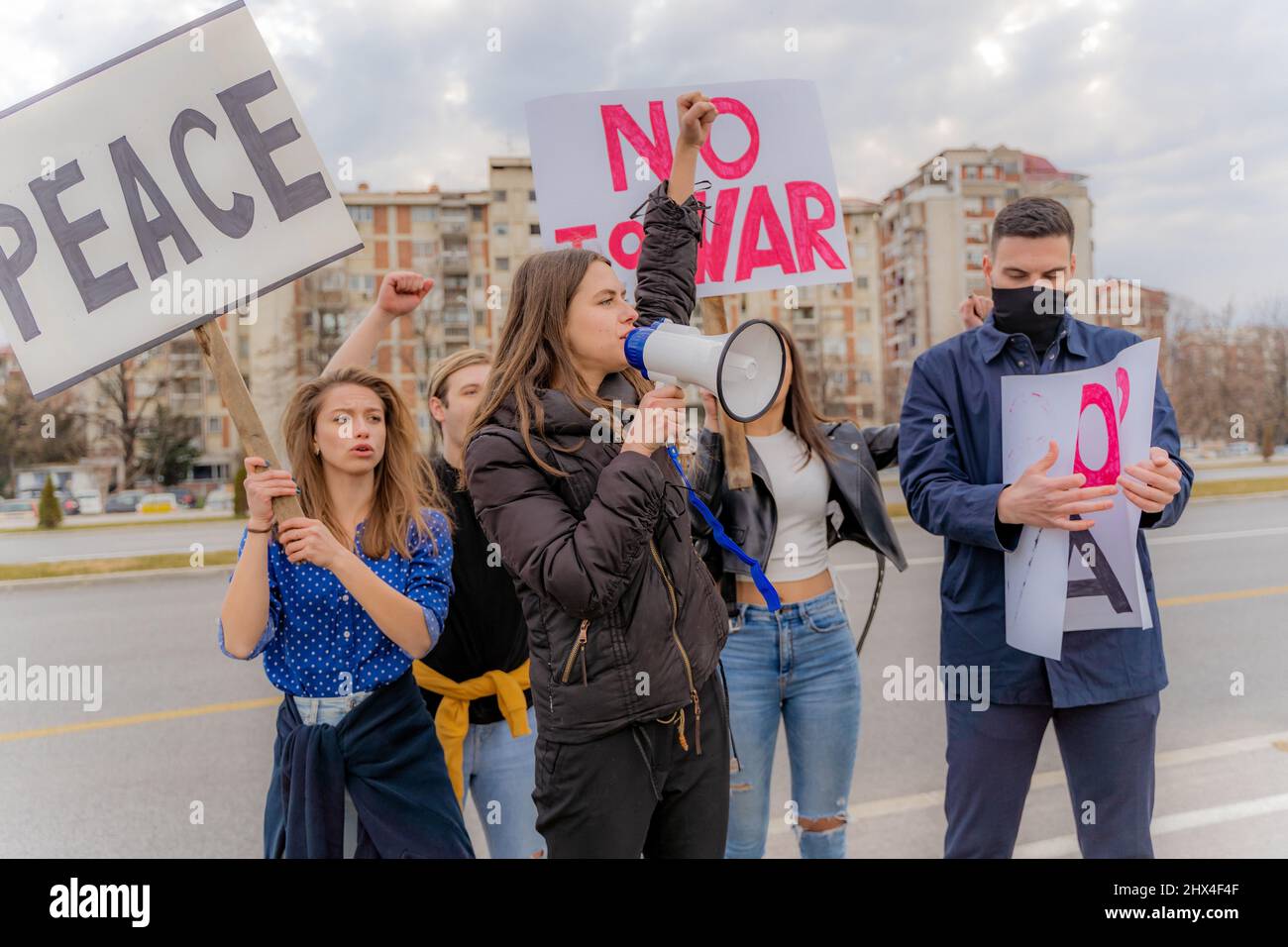 Group of young people are shouting together on the street Stock Photo ...