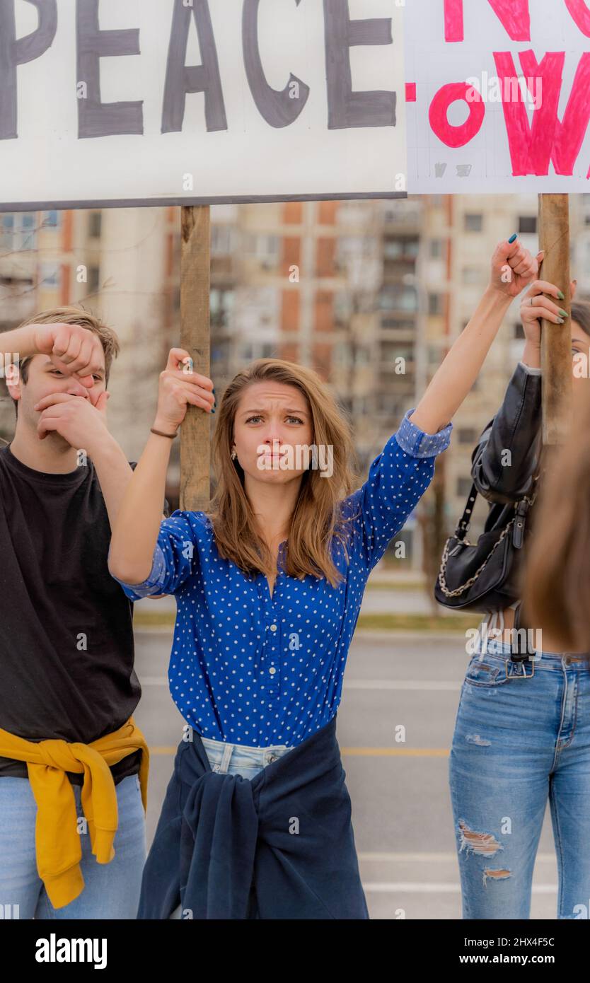 Group of beautiful young people are shouting and protesting together ...