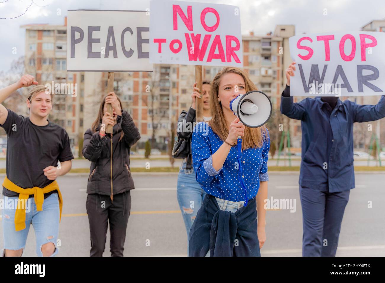Group of beautiful and sad people are protesting loud together on the ...