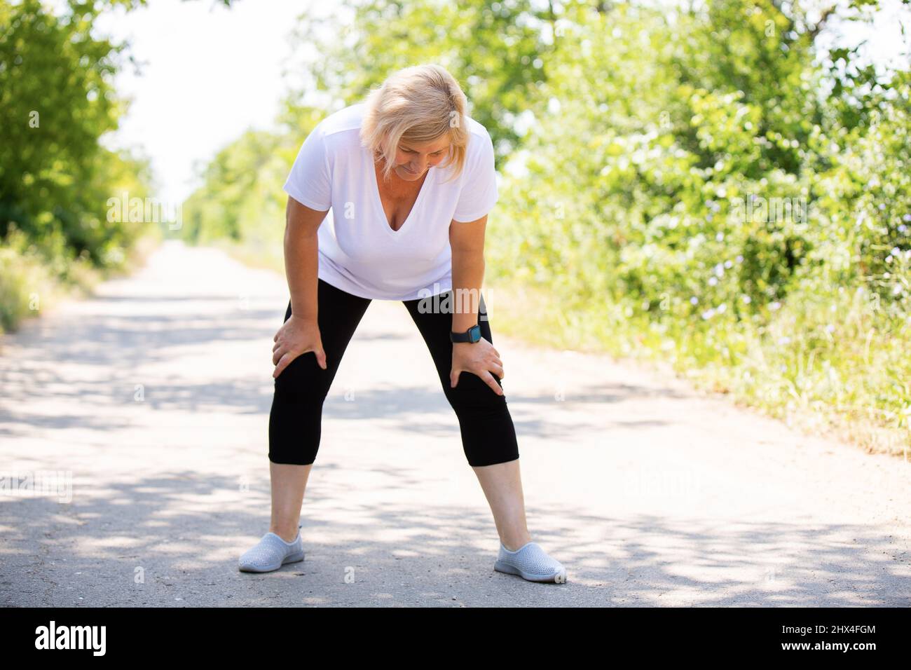 Resting head on knees hi-res stock photography and images - Alamy