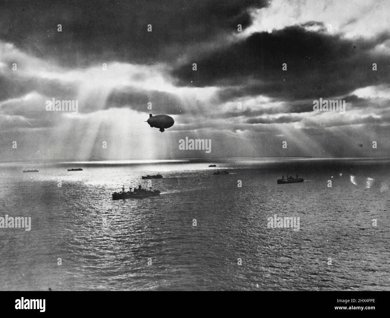 Allied Convoy: A U.S. Navy patrol blimp hovers protectingly over the ...