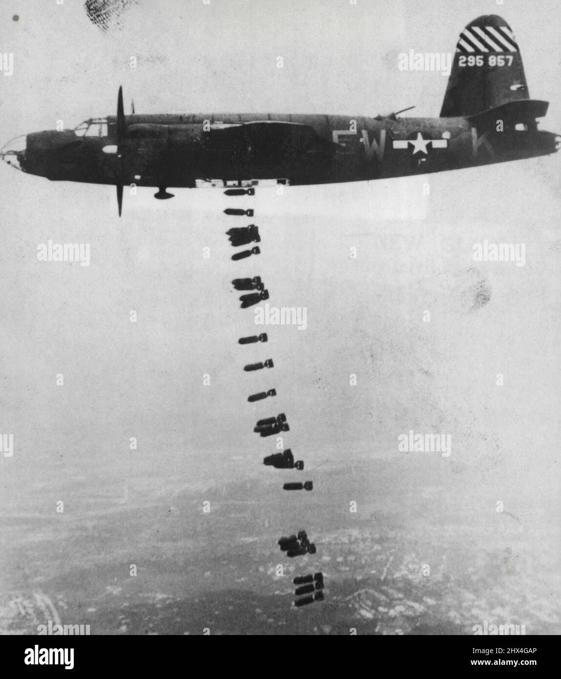 A stick of 26 bombs being released from a Marauder medium bomber during ...