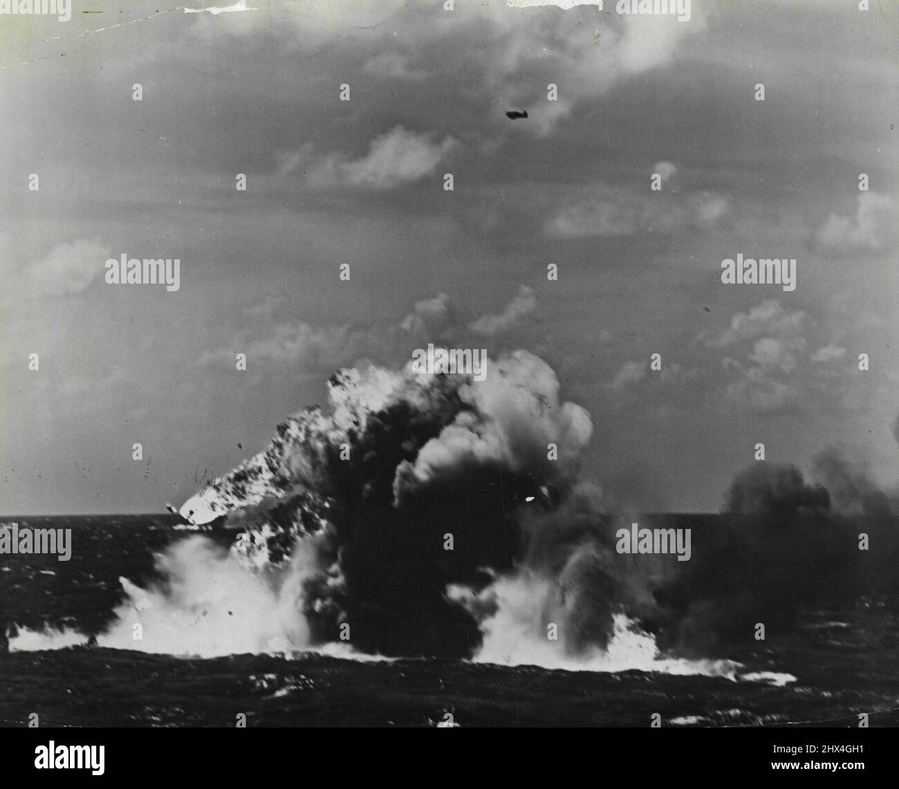 A violent explosion occurs as a burning Jap torpedo plane dives into ...