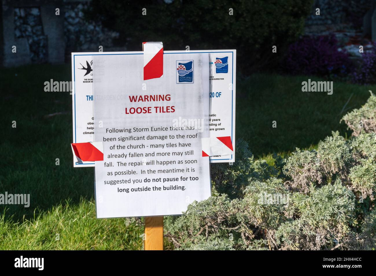 Notice warning of loose roof tiles due to damage by Storm Eunice in ...