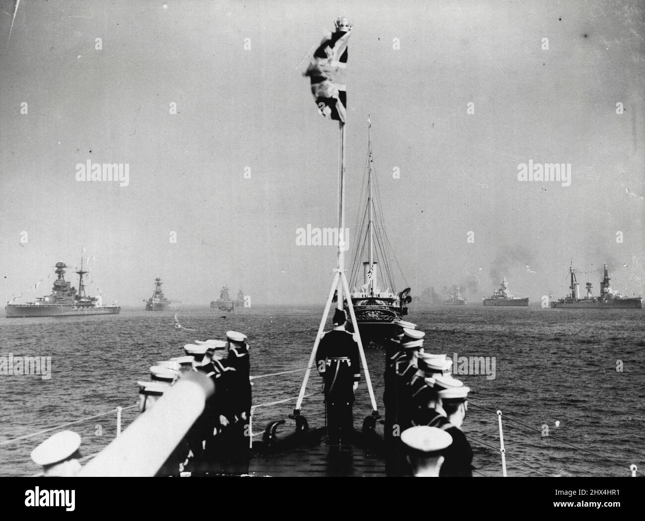 The King Reviews His Fleet - The Royal yacht Victoria and Albert passing down the line of ...