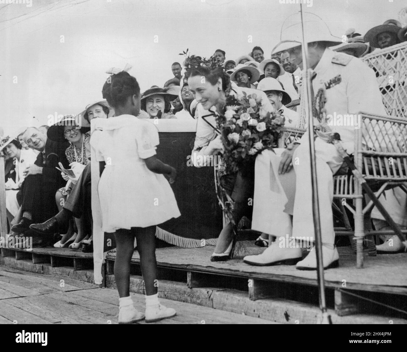 The Windsors at War .... and the Duchess accepts the inevitable bouquet ...