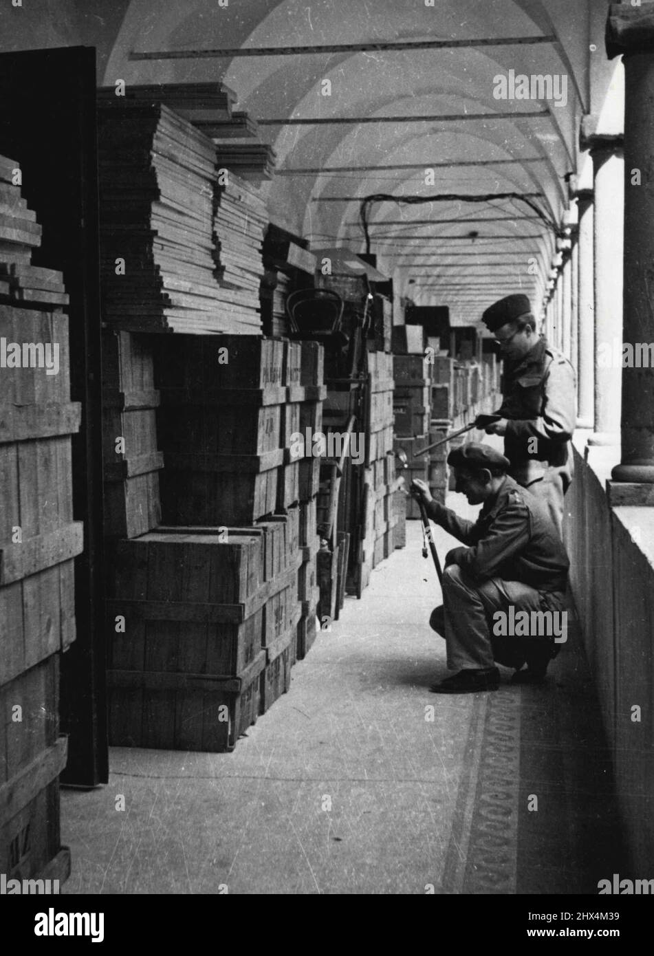 Discovery of Hoard of Nazi-Looted Books -- A British soldier standing ...