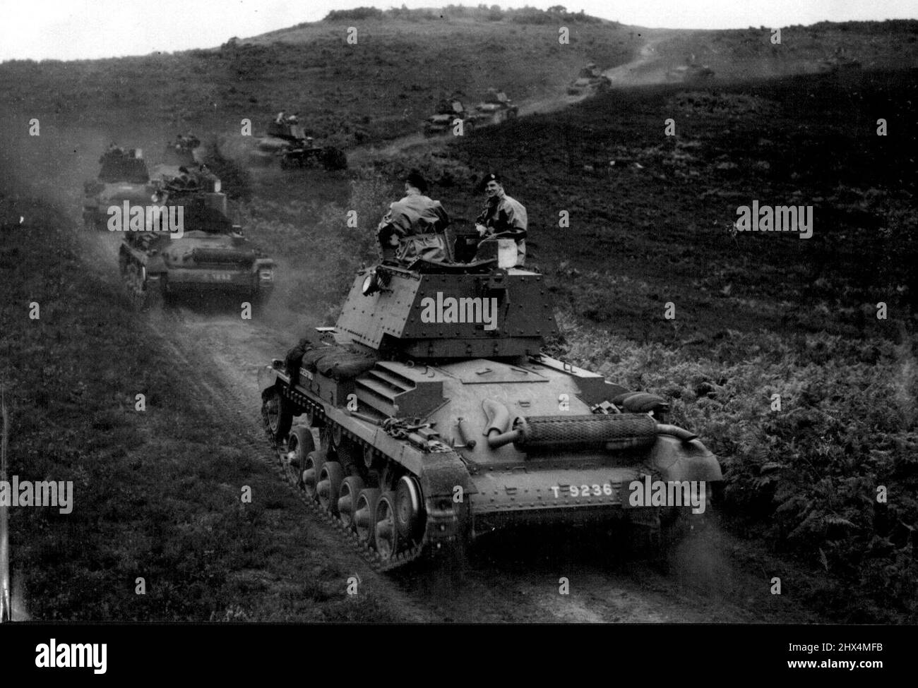 A Day With The Royal Tank Regiment -- A line on tanks crossing a common ...