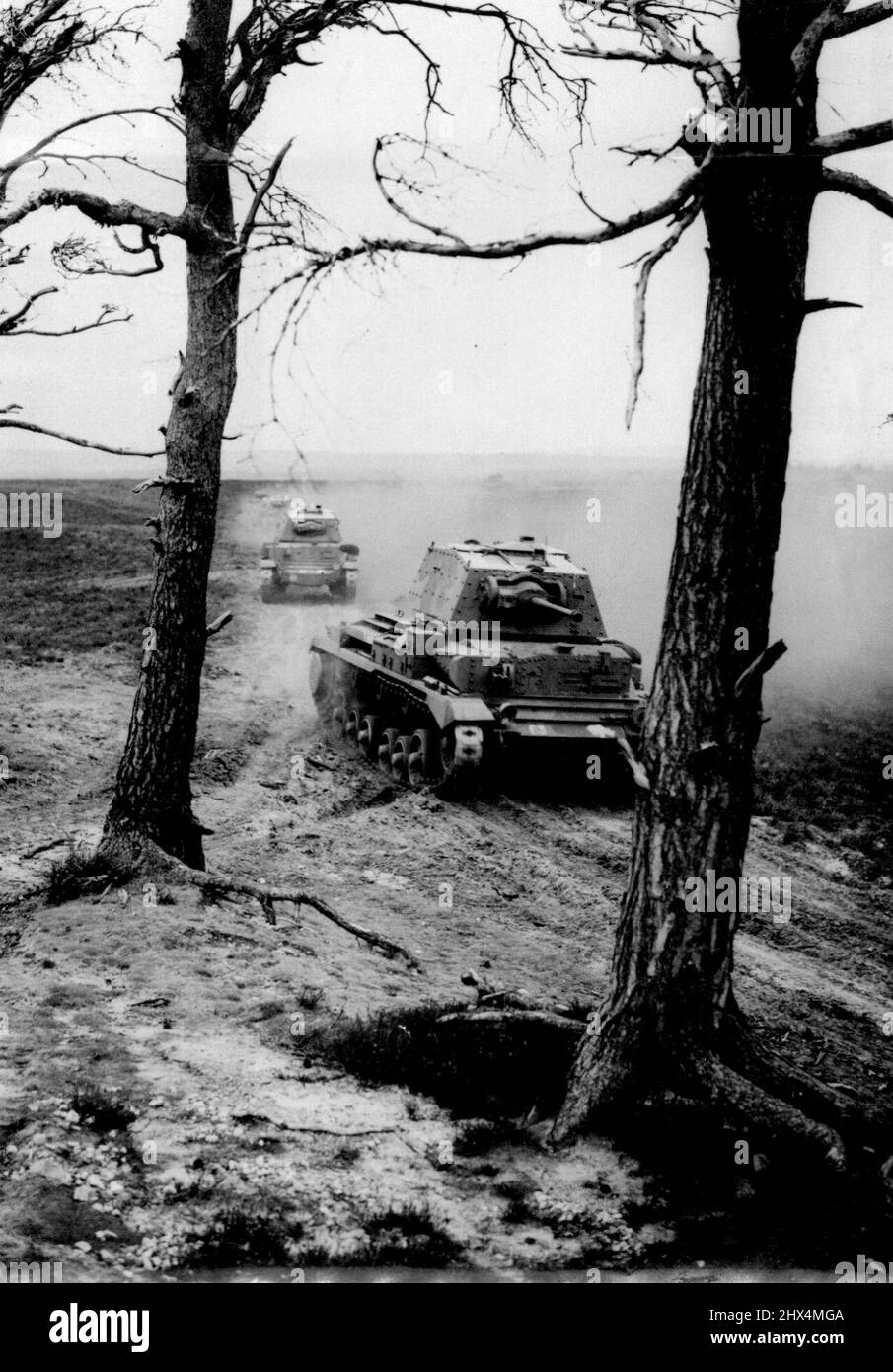 A Day With The Royal Tank Regiment -- A Line of tanks crossing a common ...
