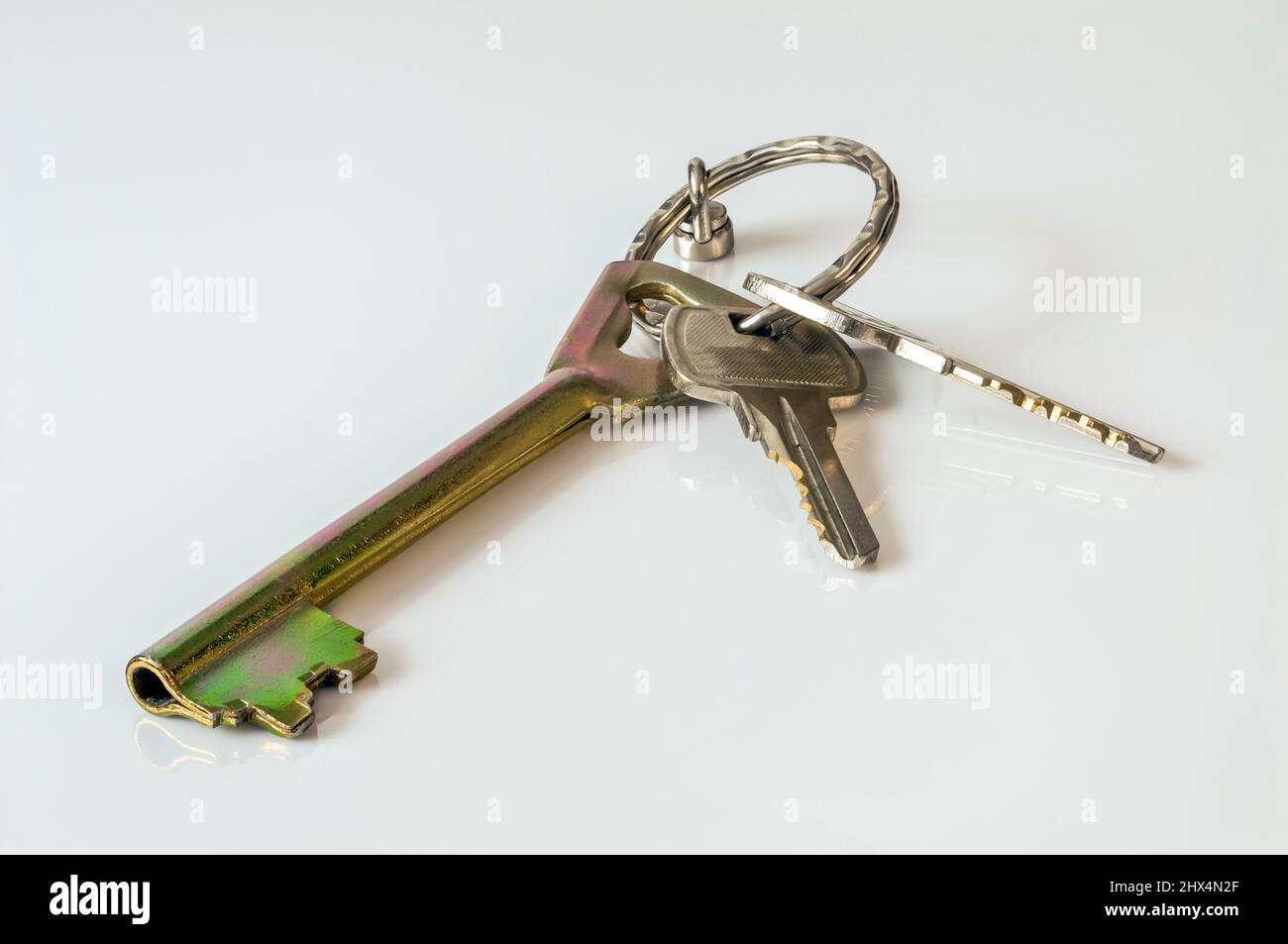 Keys to an apartment, house on a metal ring, on a white background ...