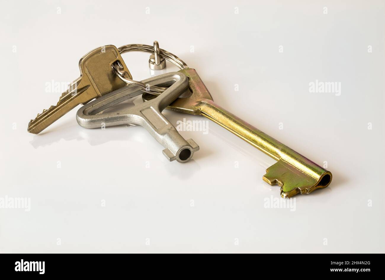 Keys to an apartment, house on a metal ring, on a white background ...