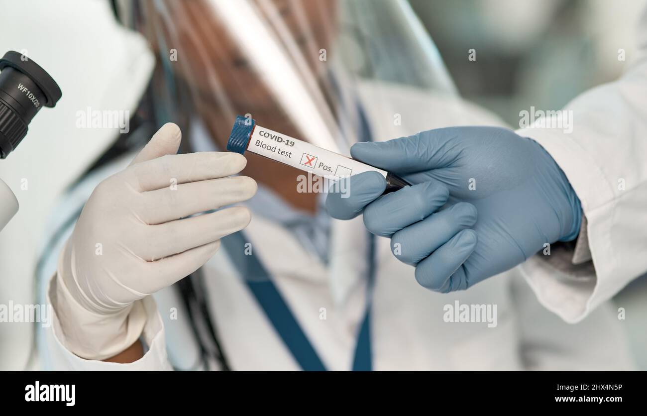 The result is confirmed. Closeup shot of an unrecognisable scientist ...