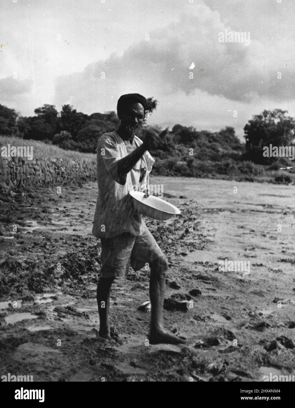 A Village In India -- His feet squelching in the sticky mud of the ...