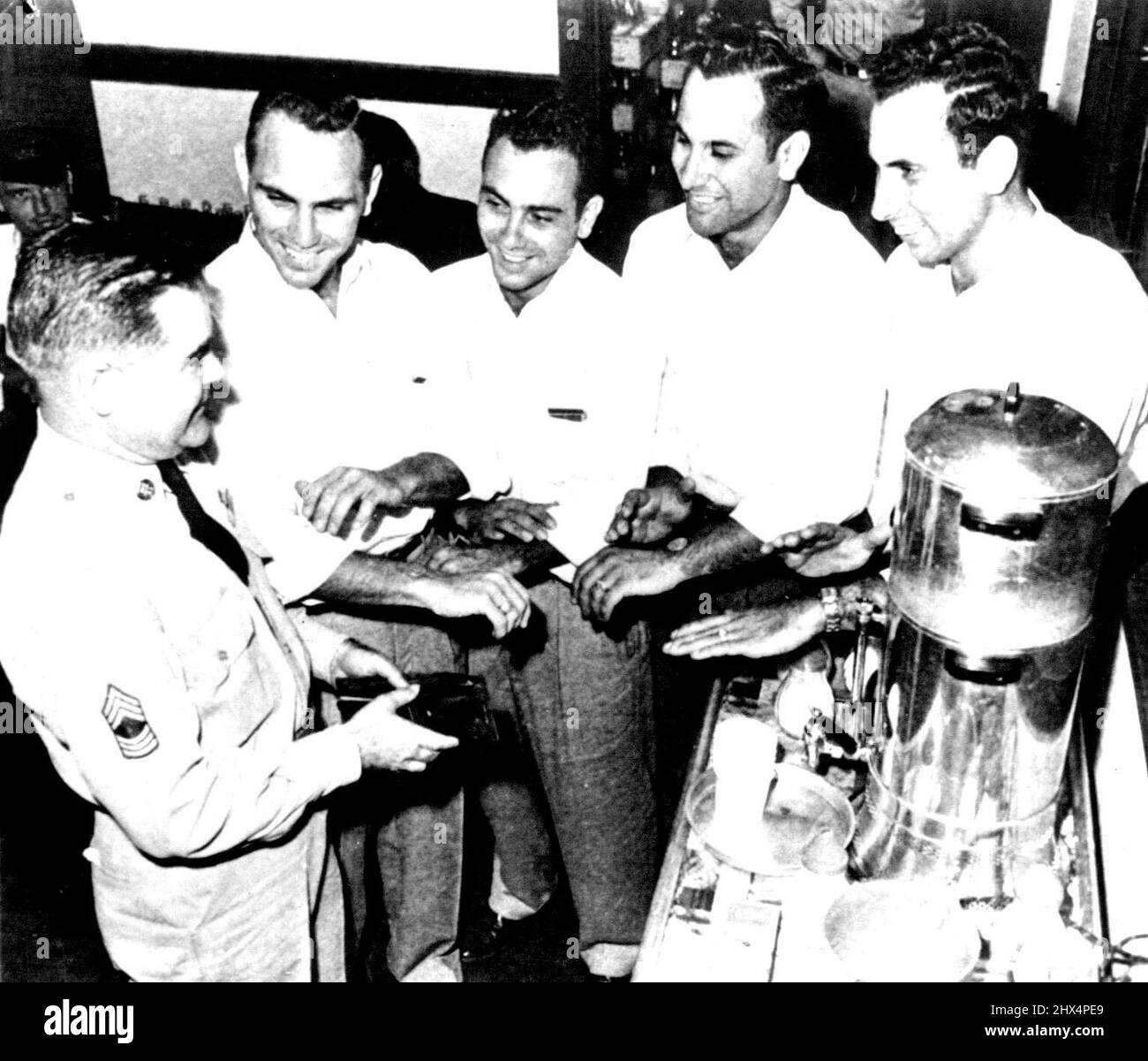 Quads Take Exam - Sgt.Truman L. Douglas matches coing with the 20 year ...