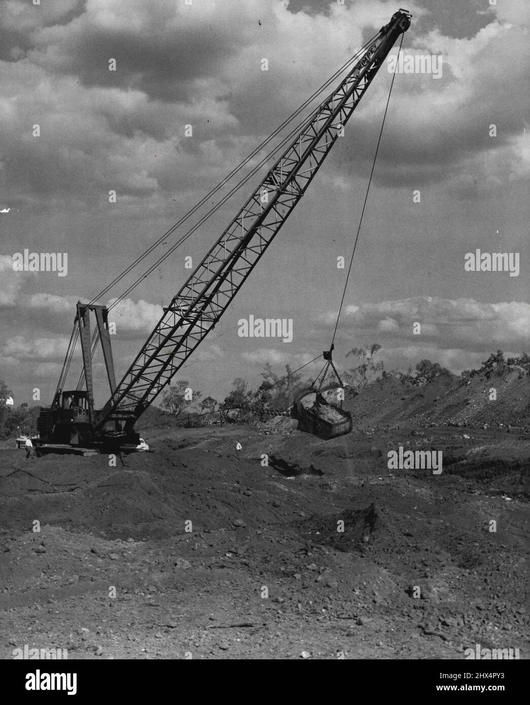 A 190 ton mobile drag line scoop digs a new bed to divert the East ...