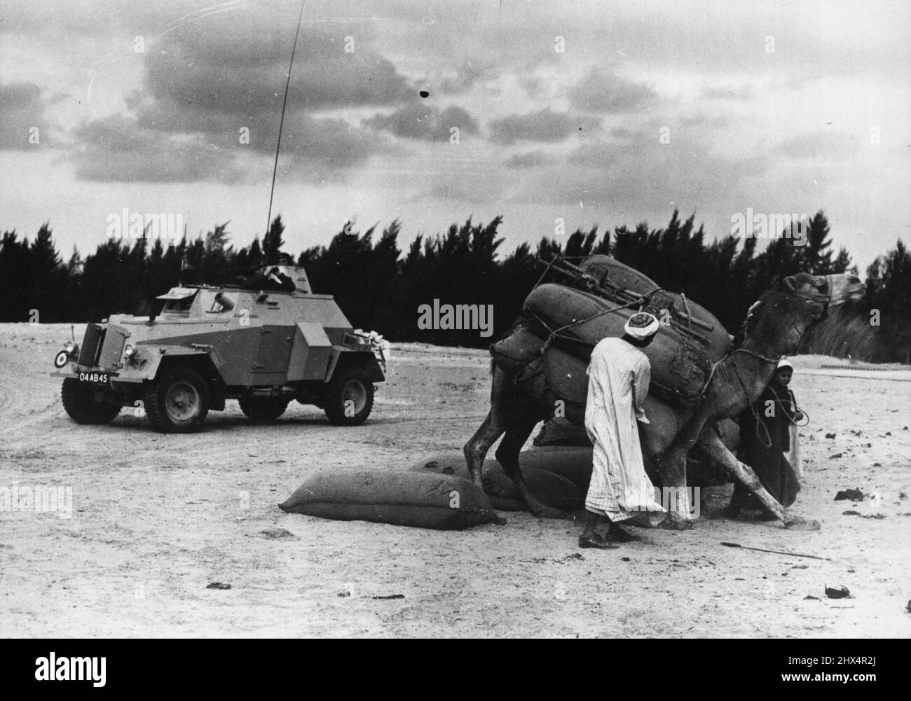 RAF Regiment Armored Cars in Canal Zone Desert.With an armored car of ...