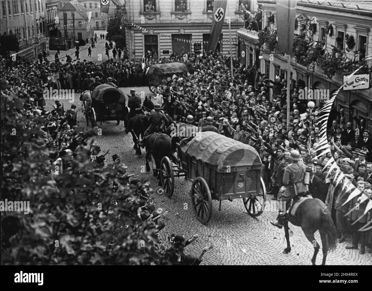 Sudetenland Welcomes The German Army. By long car columns German troops ...