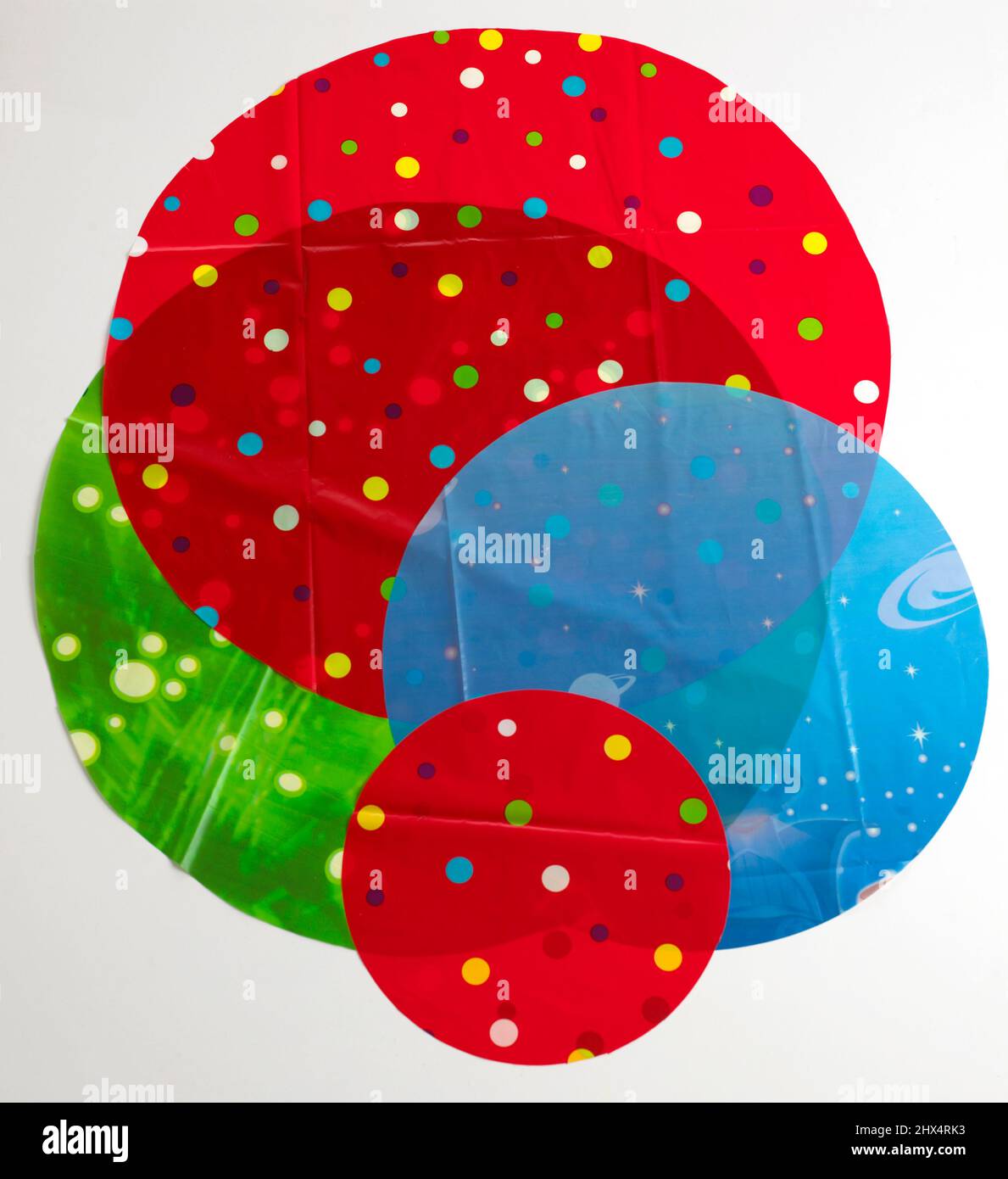 Colourful circular pieces of plastic Stock Photo - Alamy