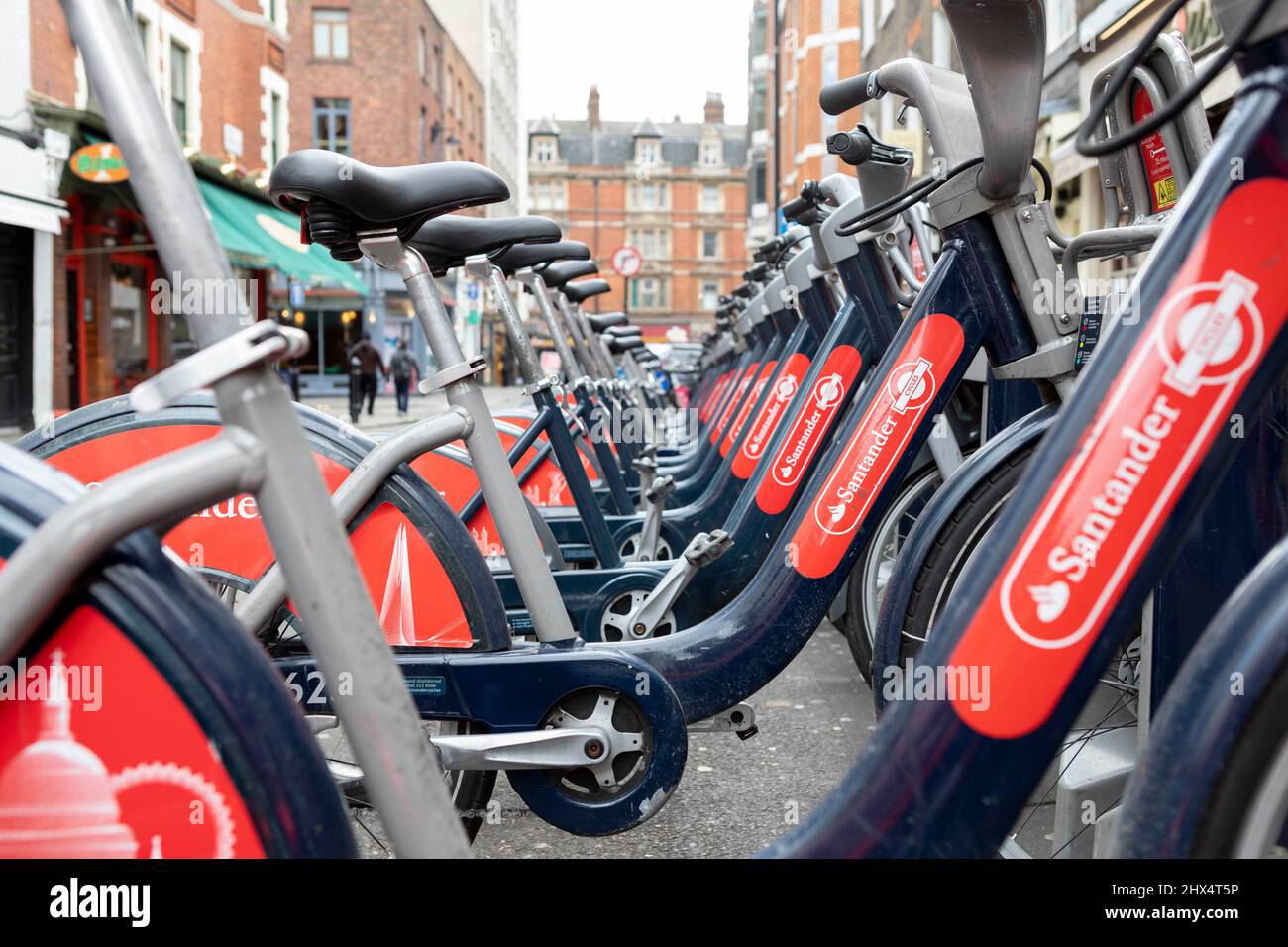 Santander Cycles docked at a Santander Cycle hire station in Soho shot ...