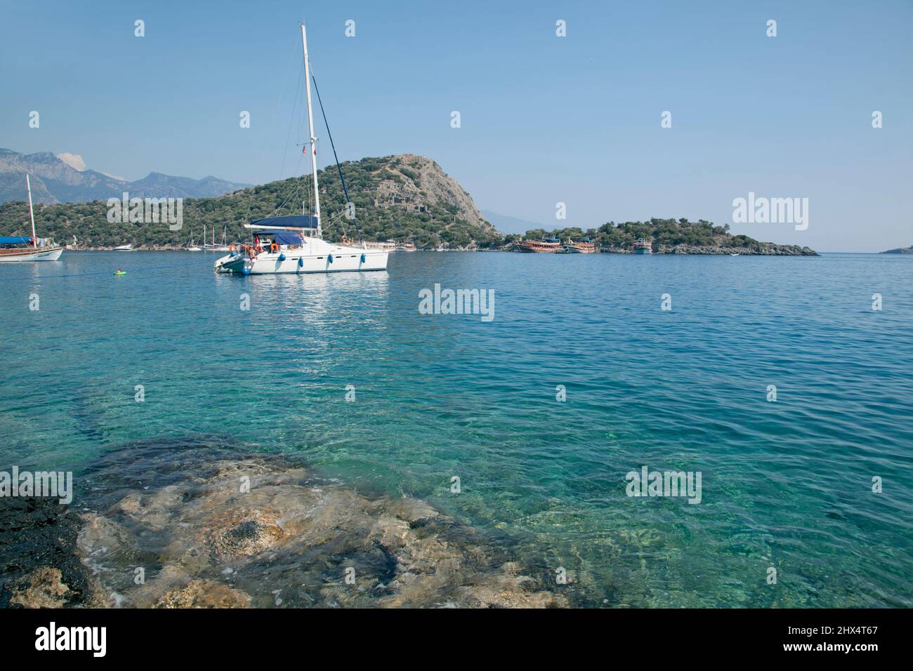 Turkey, near Fethiye, boats anchored off St Nicholas Island, seen from ...