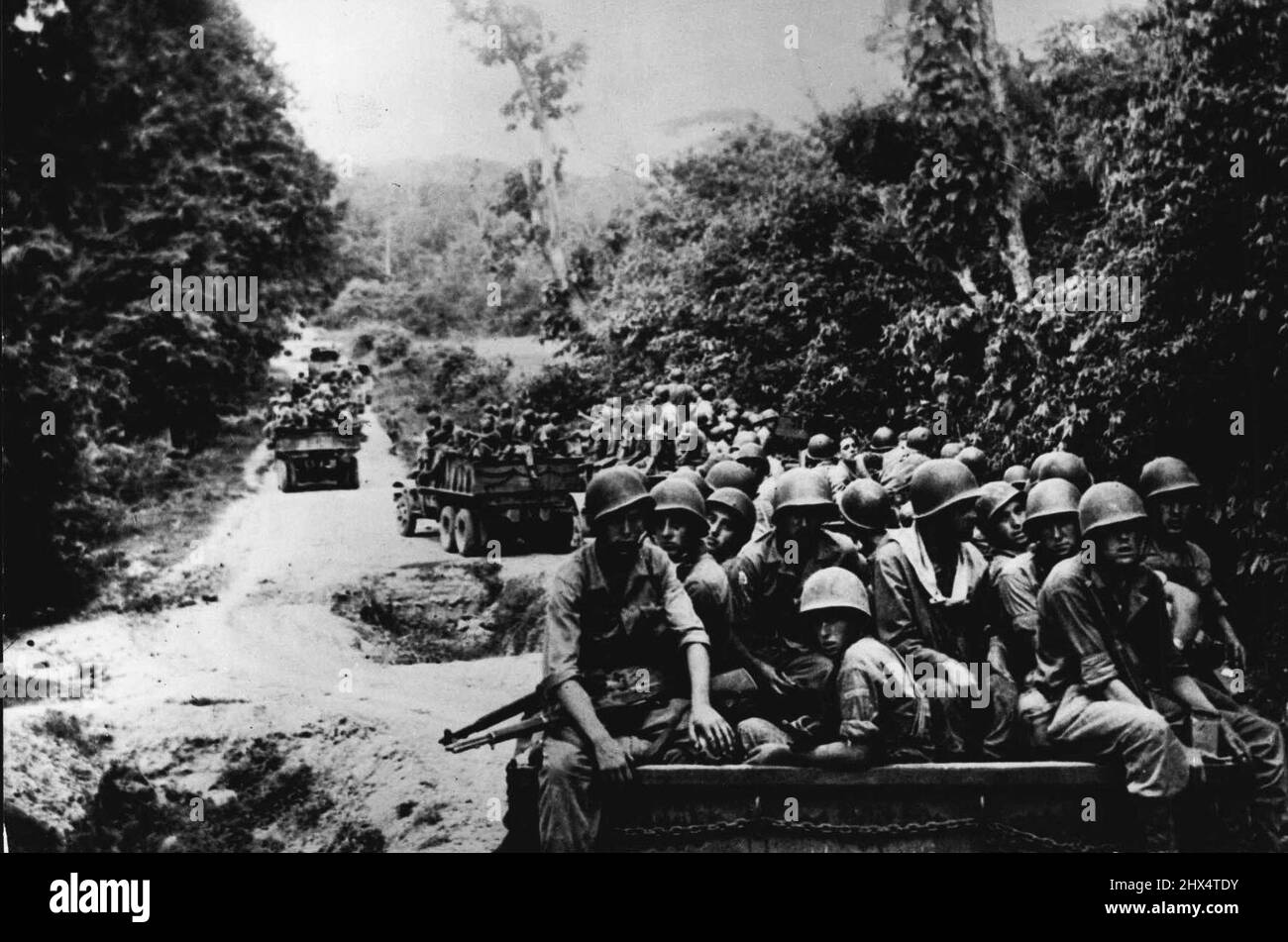 Dutch Troops in Action in Indonesia. A motorized column of Dutch troops ...