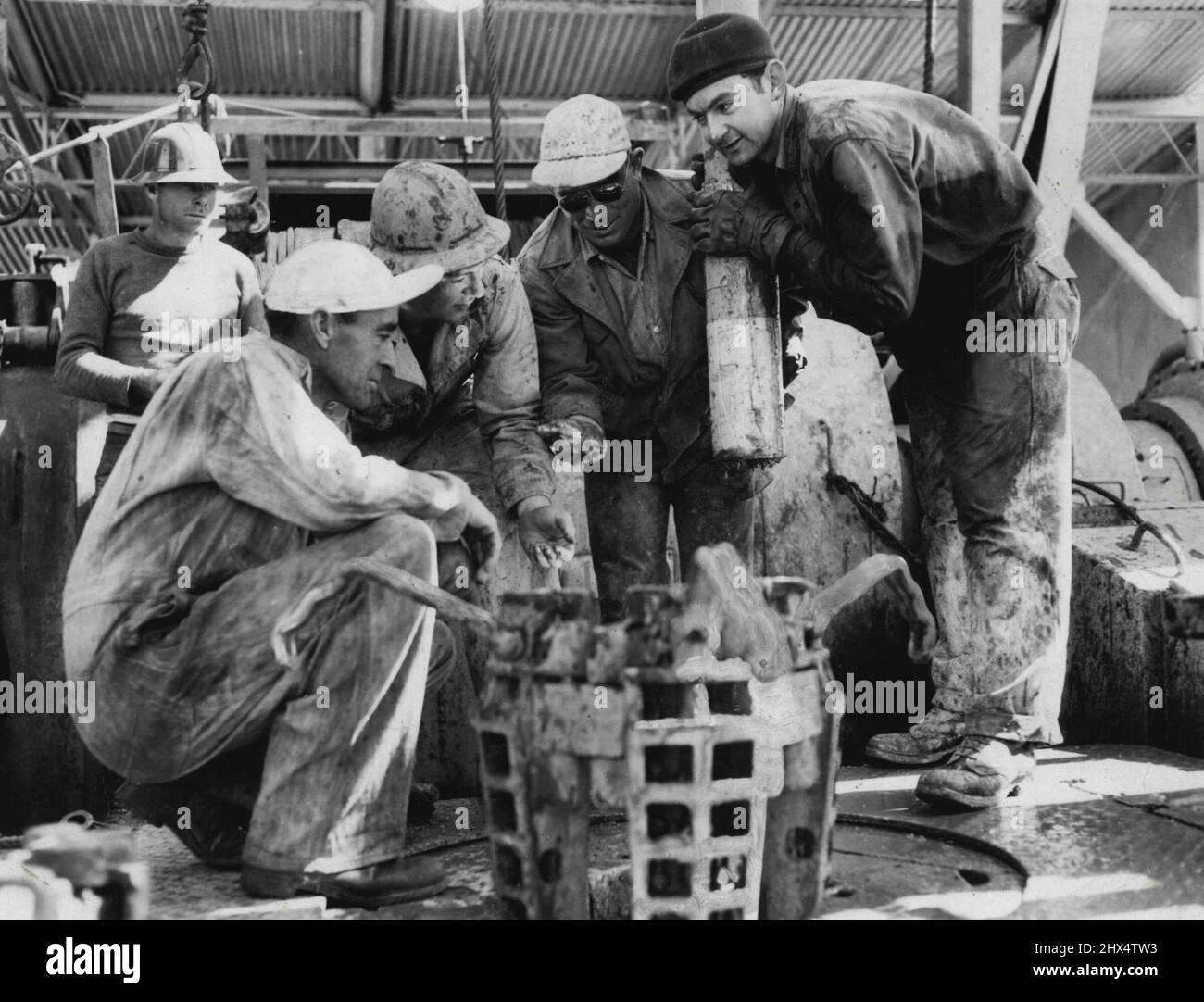 A drilling crew on the Rough Range No. 1 oil rig in Western Australia ...
