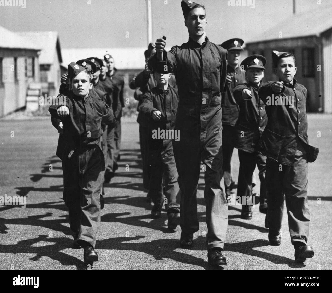 All shapes and sizes on the parade square, 6ft. 2in. to 4ft. 8in. (L-R ...