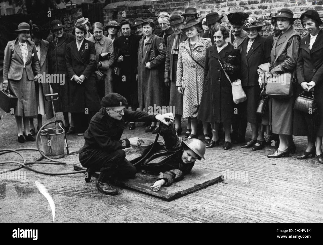 W.V.S. to Become Fire Fighters. - W.V.S. watching a demonstration in ...