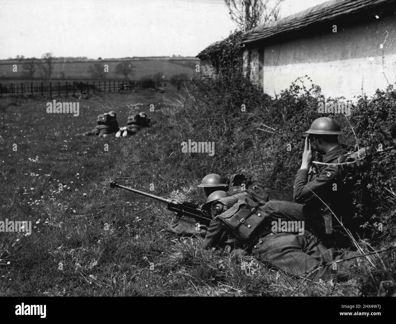 Troops with anti-tank rifles covering a roadway during a large-scale ...