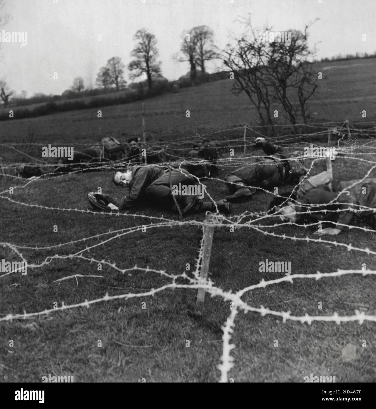 Crawl: "Obstacle race" teaches padre how to crawl along under barbed ...