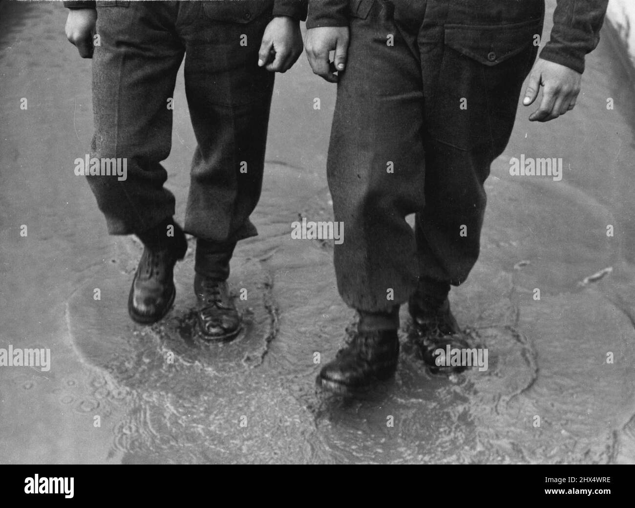 Army Tests Equipment For Arctic And Tropics -- Troops sloshing through ...