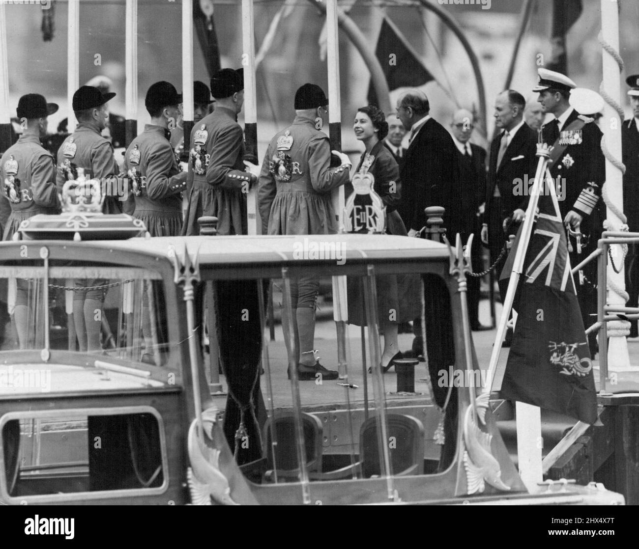The Queen's watermen form a guard of honour as the Queen prepares to ...
