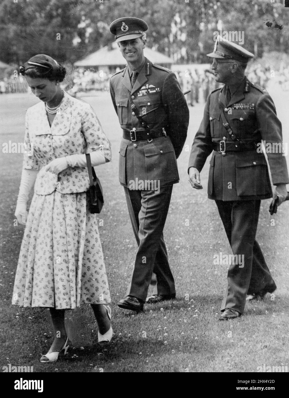 Duke of Edinburgh is caught in a happy mood as he escorts Queen ...