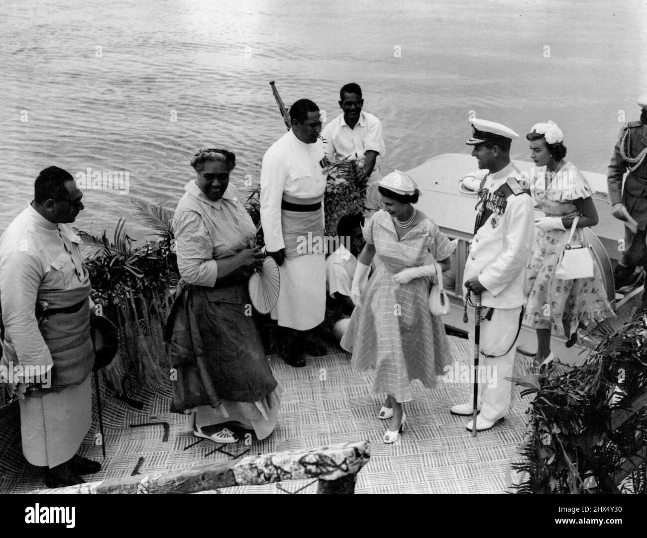 Queen Salote of Tonga greets her Royal guests, Queen Elizabeth and the ...