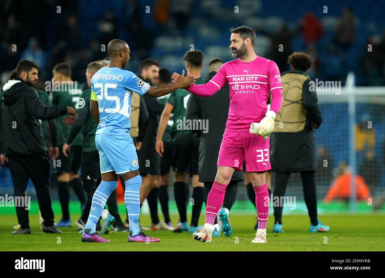 Manchester City's Fernandinho (left) and goalkeeper Scott Carson shake ...