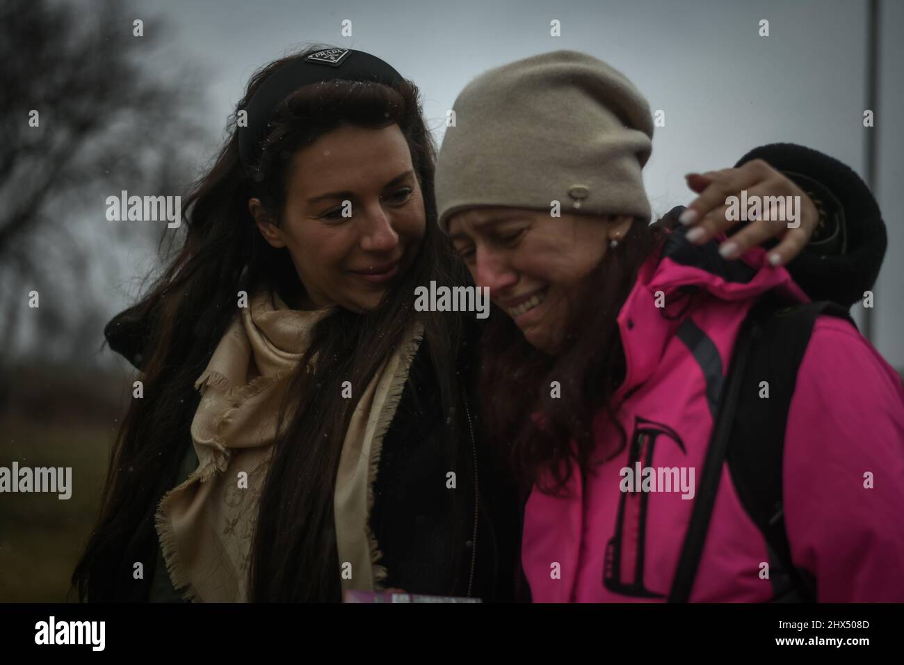Medyka, Poland, March 9, 2022: a woman cries as refugees from Ukraine ...