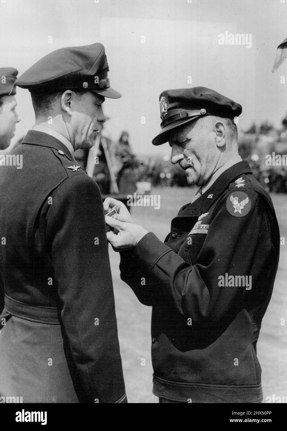 Lt.-Gen. Carl Spaatz presenting the war Department Citation Medal to ...