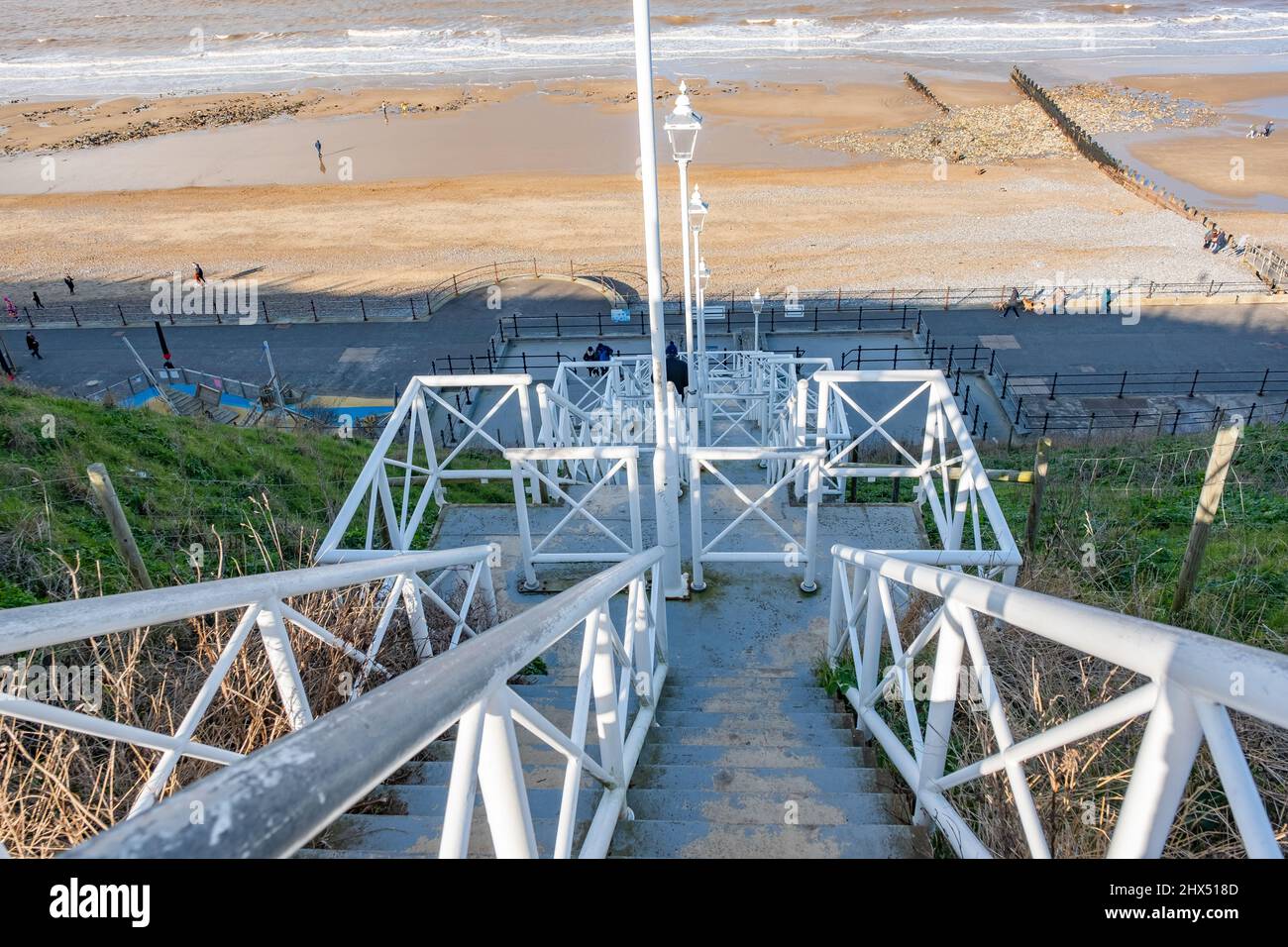 Intricate staircase from the cliff top down to the beach in the seaside ...