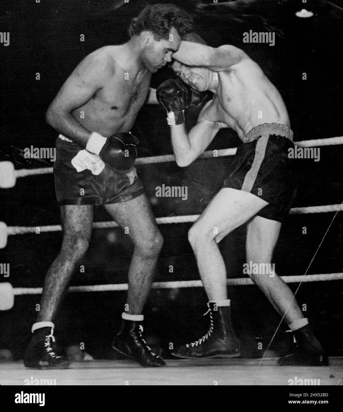Sands Wins On Points -- A left from Pete Mead (U.S.A) hurtles past the ...