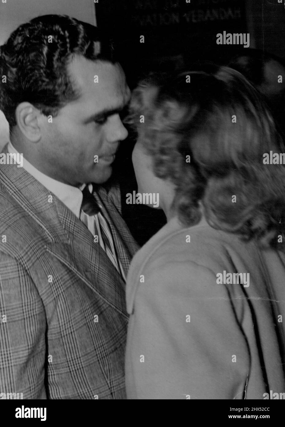 Greeting. Empire middleweight champion Dave Sands welcomed by his wife ...