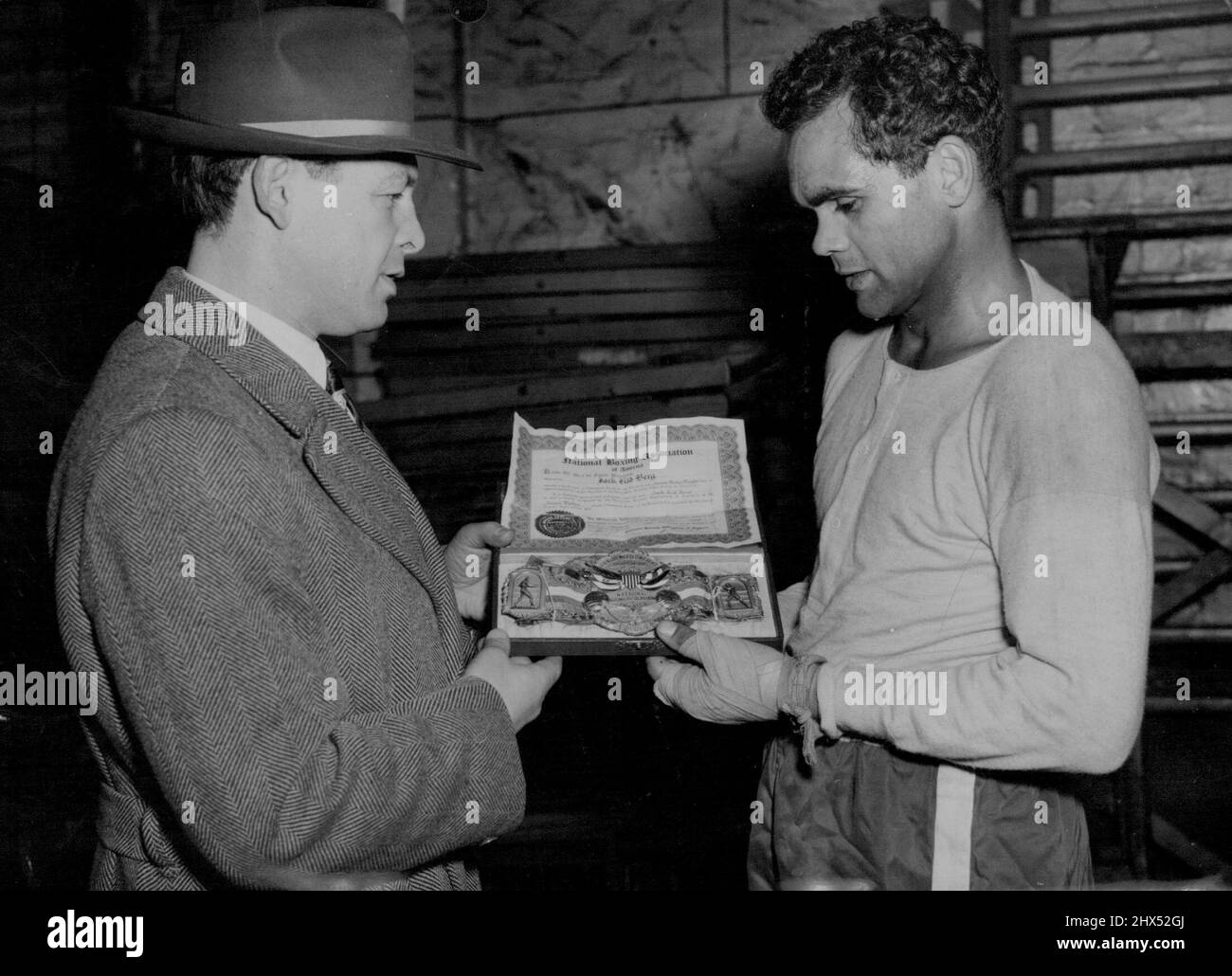 Champions Meet -- Australia's triple champion, Dave Sands, admires the ...