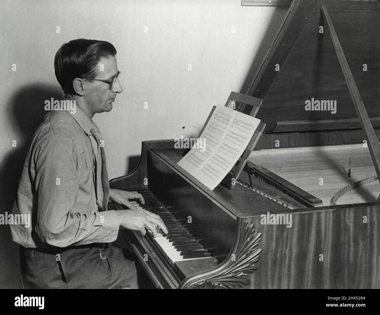 Mr. Rene Barnett playing the harpsichord he made himself in syllabus at ...