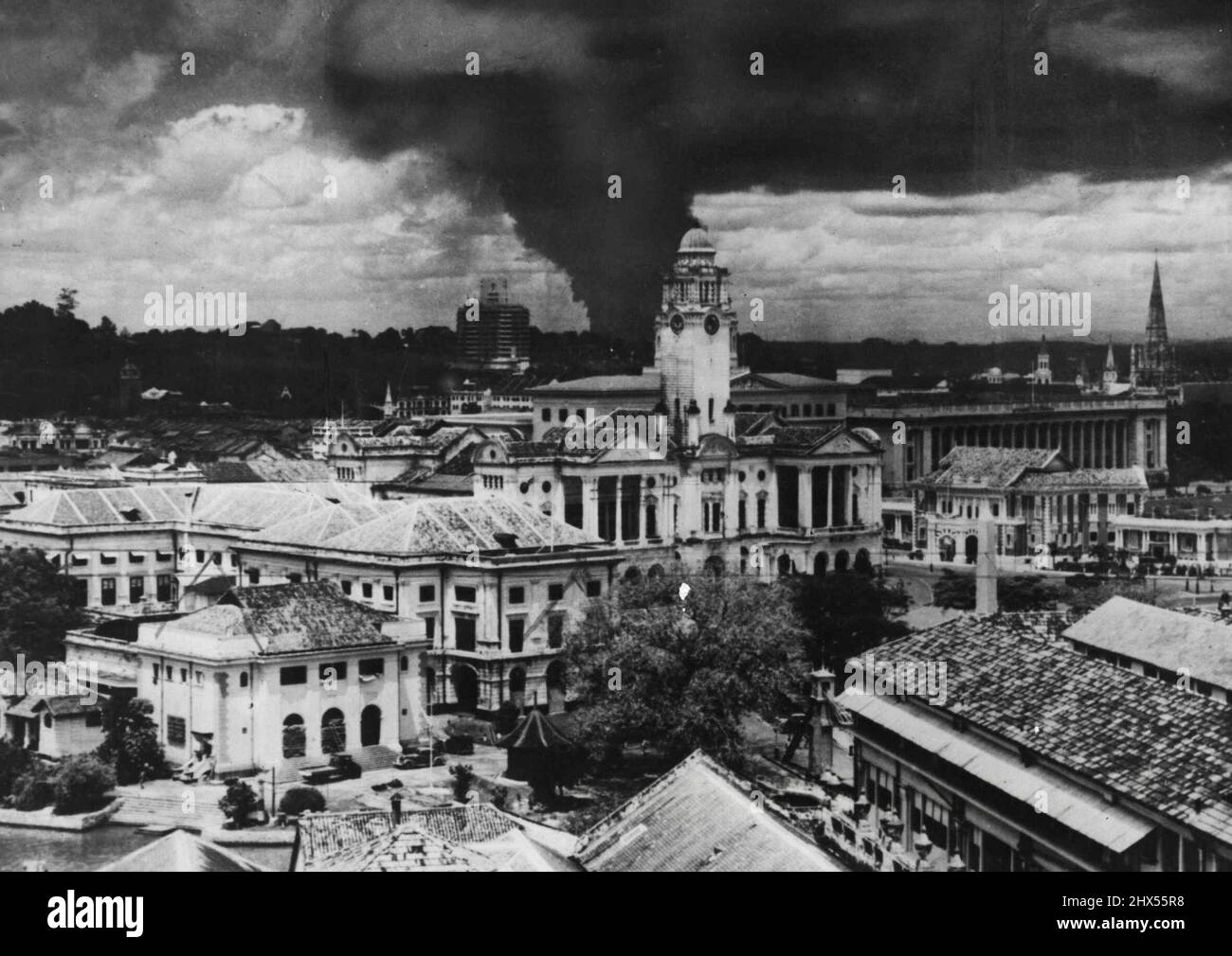 Smoke clouds above Singapore, just before the surrender. "Huge fires ...