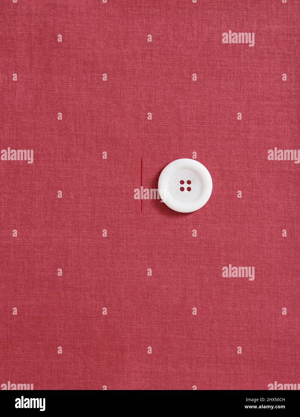 Making a bed cushion, button Stock Photo - Alamy