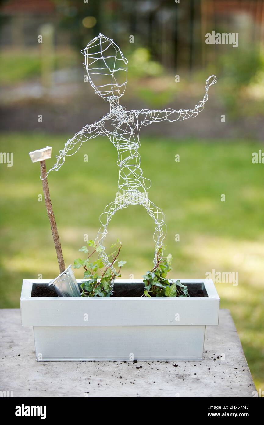 Ivy man - figure made from wire for ivy to grow up Stock Photo - Alamy