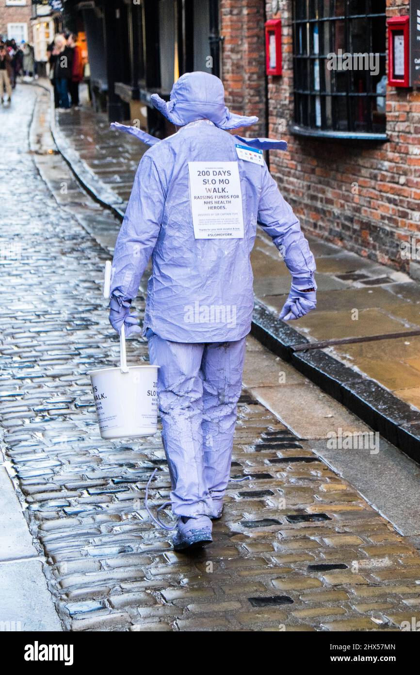Purpleguy,Guy,with,bucket,for,public,donations,doing,a,200 days, slow ...