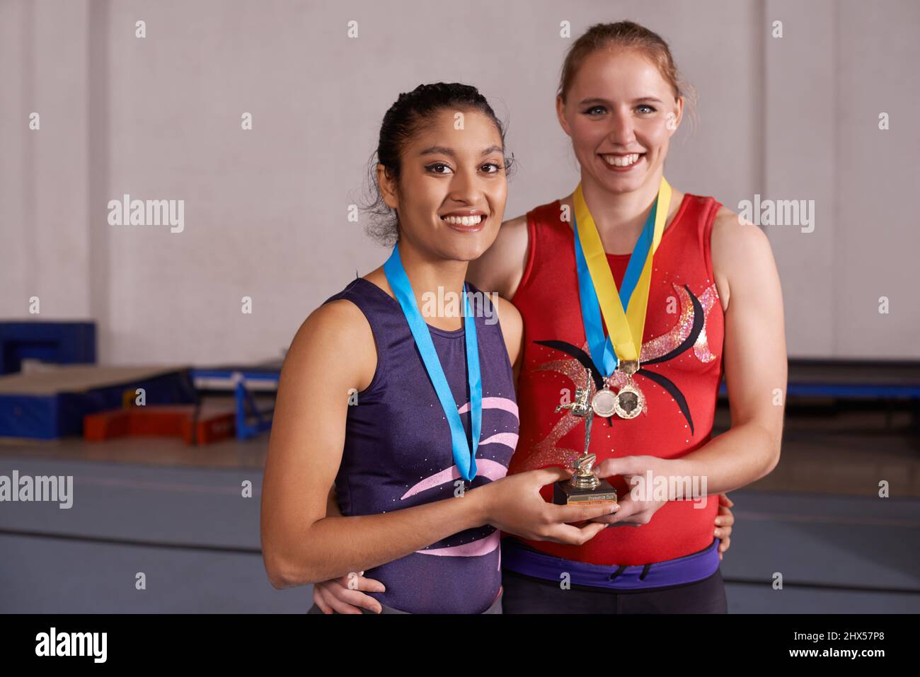 Talent wins games, teamwork wins championships. Portrait of two young ...