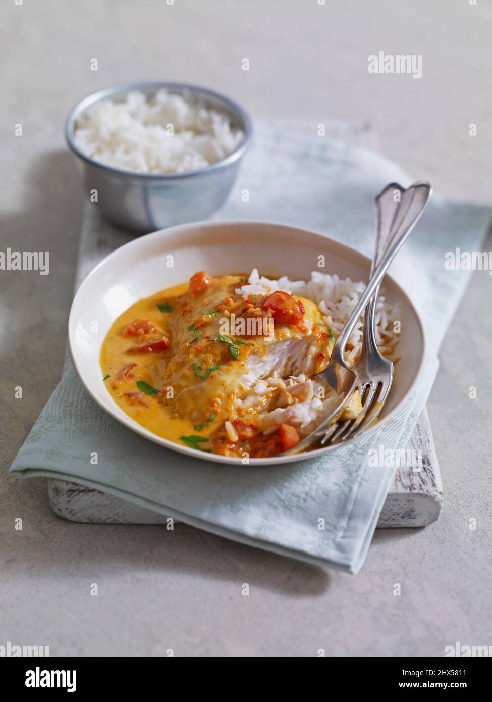 Thai red curry snapper served with rice Stock Photo - Alamy