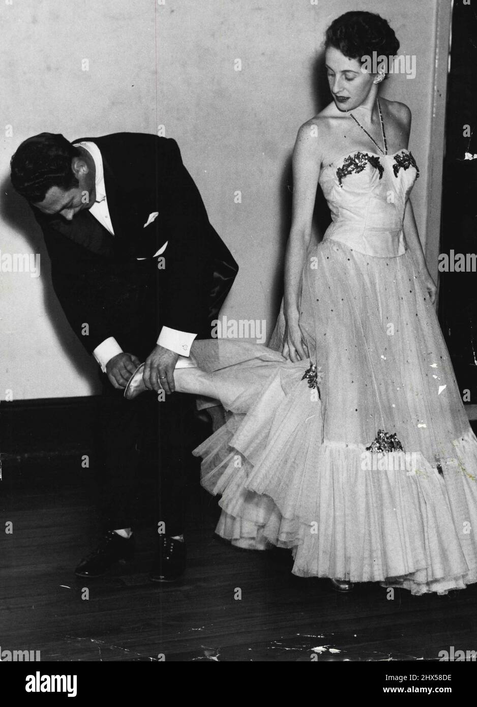Norman helps by chalking his wife's soles so she won't slip on the ...