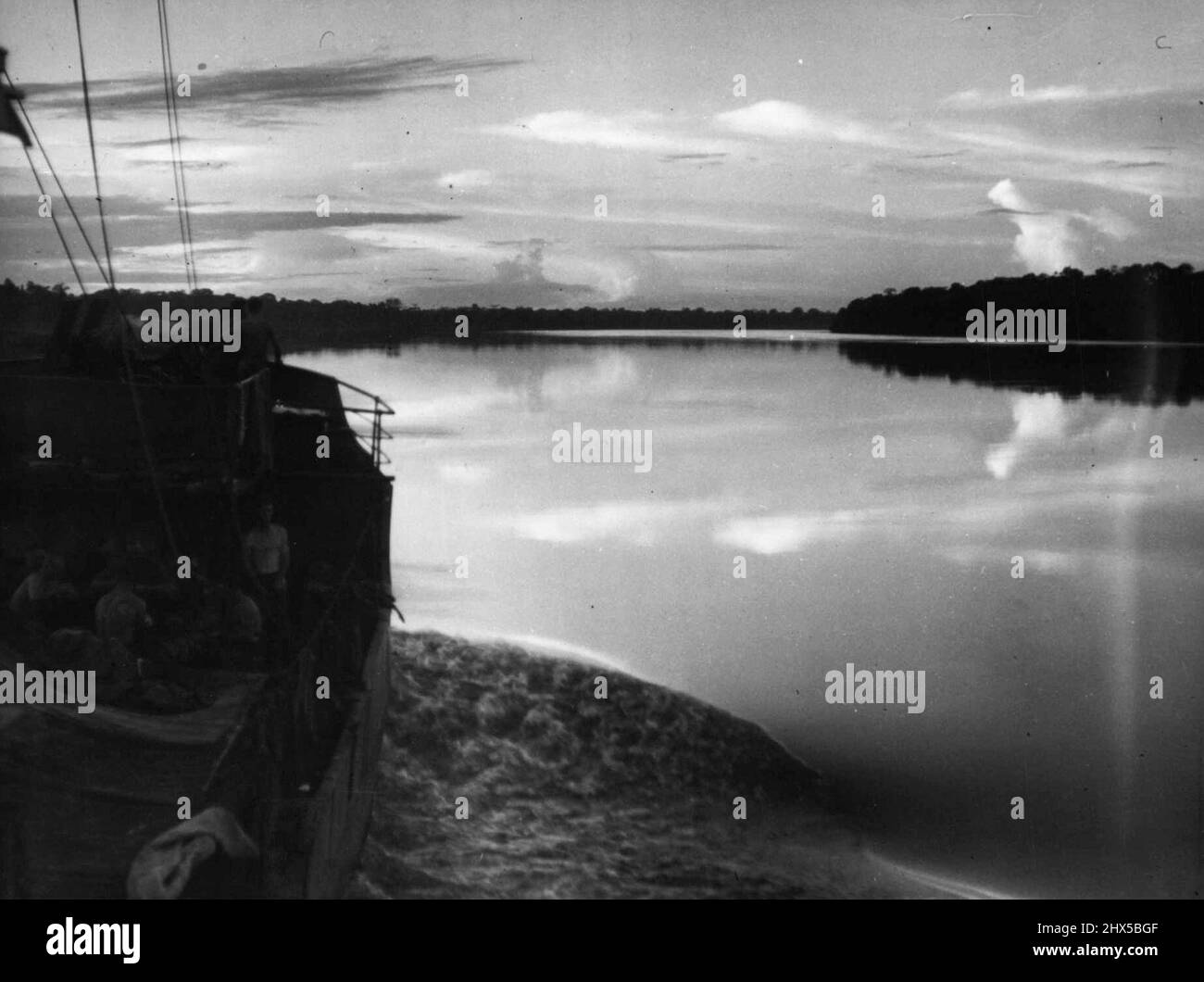 Dutch New Guinea - Picturesque sunset scene on a Dutch New Guinea river ...